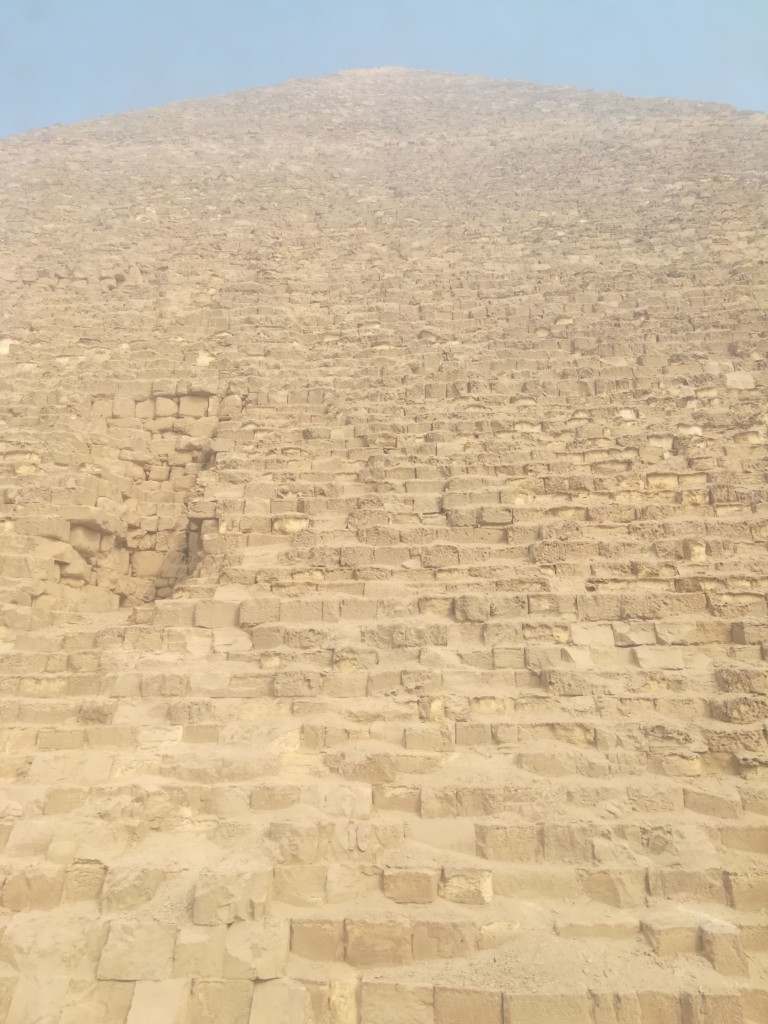 Pyramids: Their immense bulk pushes against the sky, forming a bulwark ...